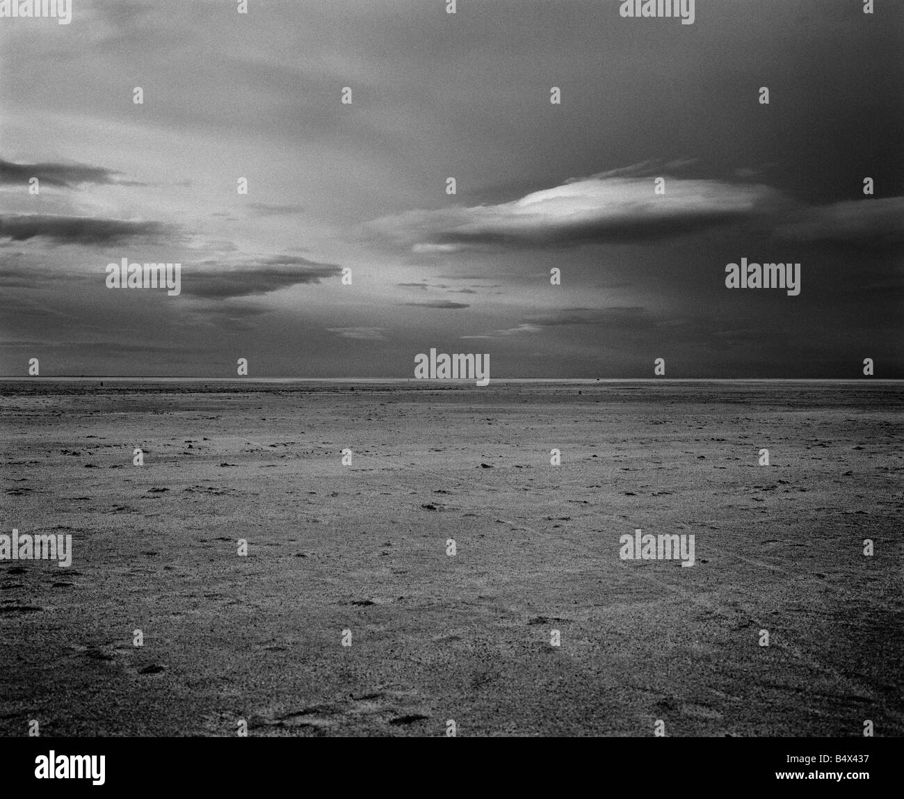 Clouds of sandy beach in Northumberland Stock Photo - Alamy