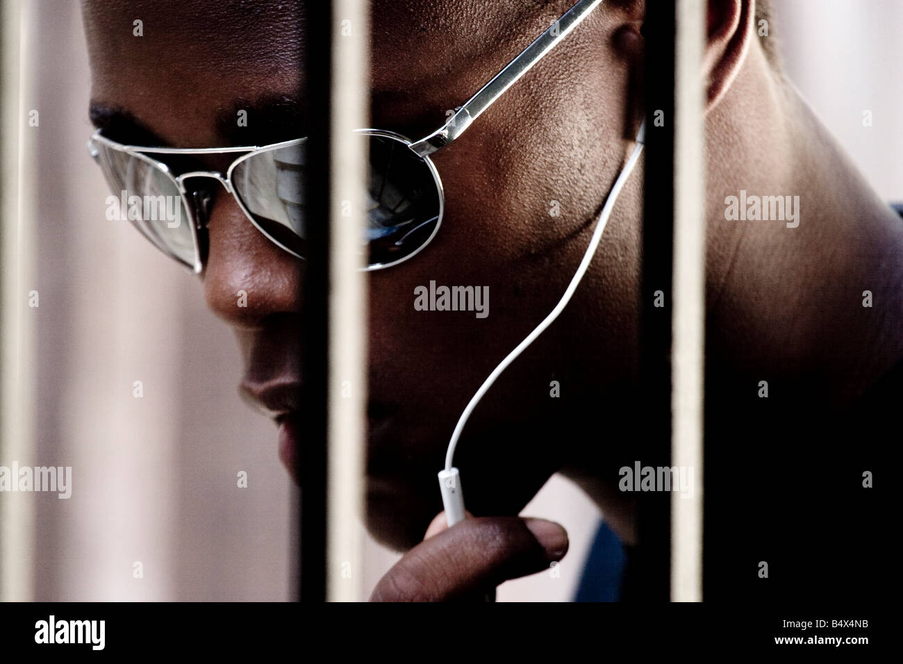 African american performing survalience, or talking on a headset. Tight ...