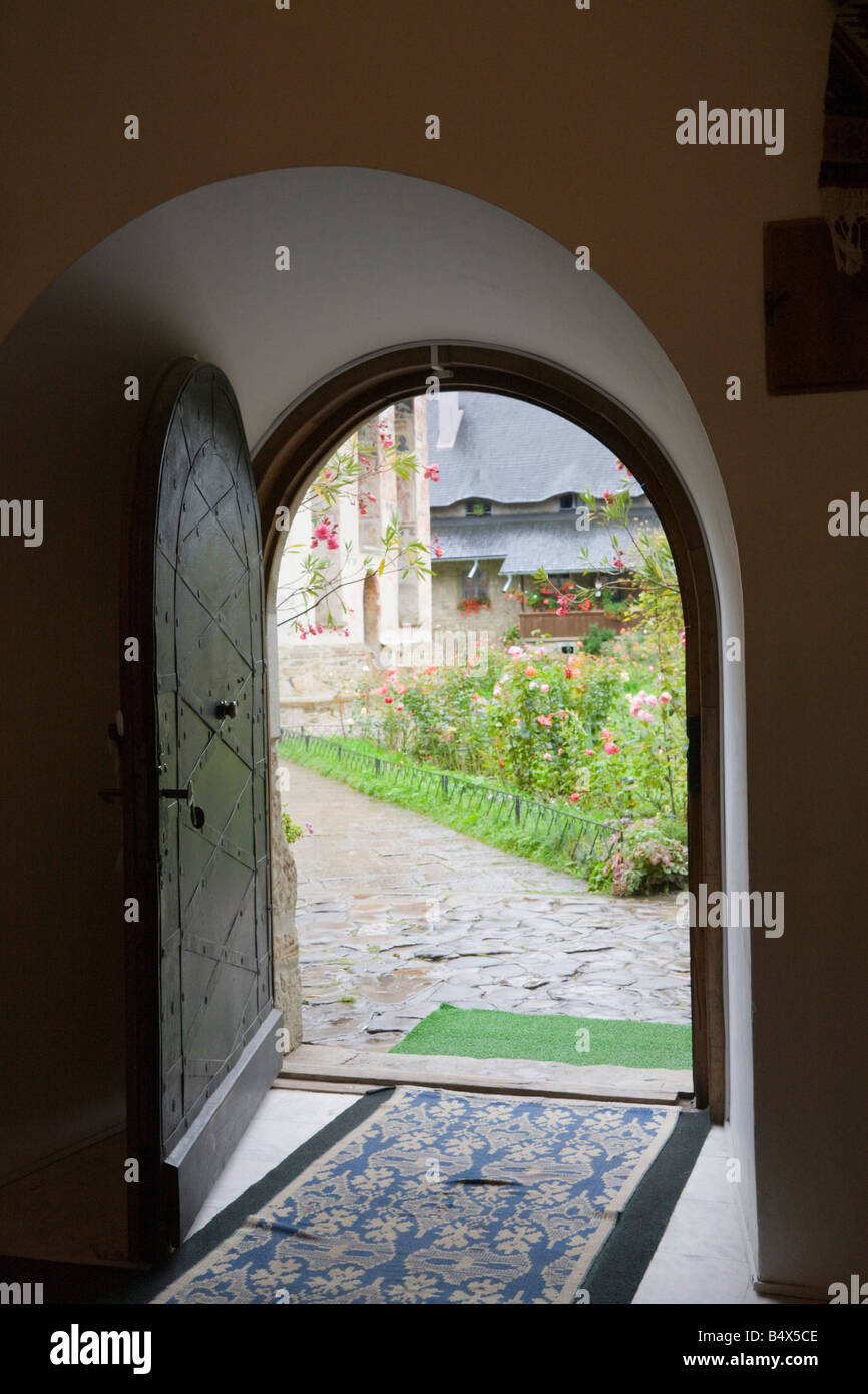 Bucovina Moldavia Romania Europe View out through old arched doorway at ...
