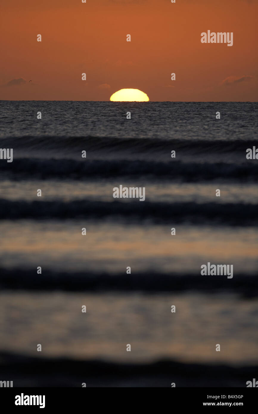 sun rising over the irish sea and waves at dawn newcastle county down ...