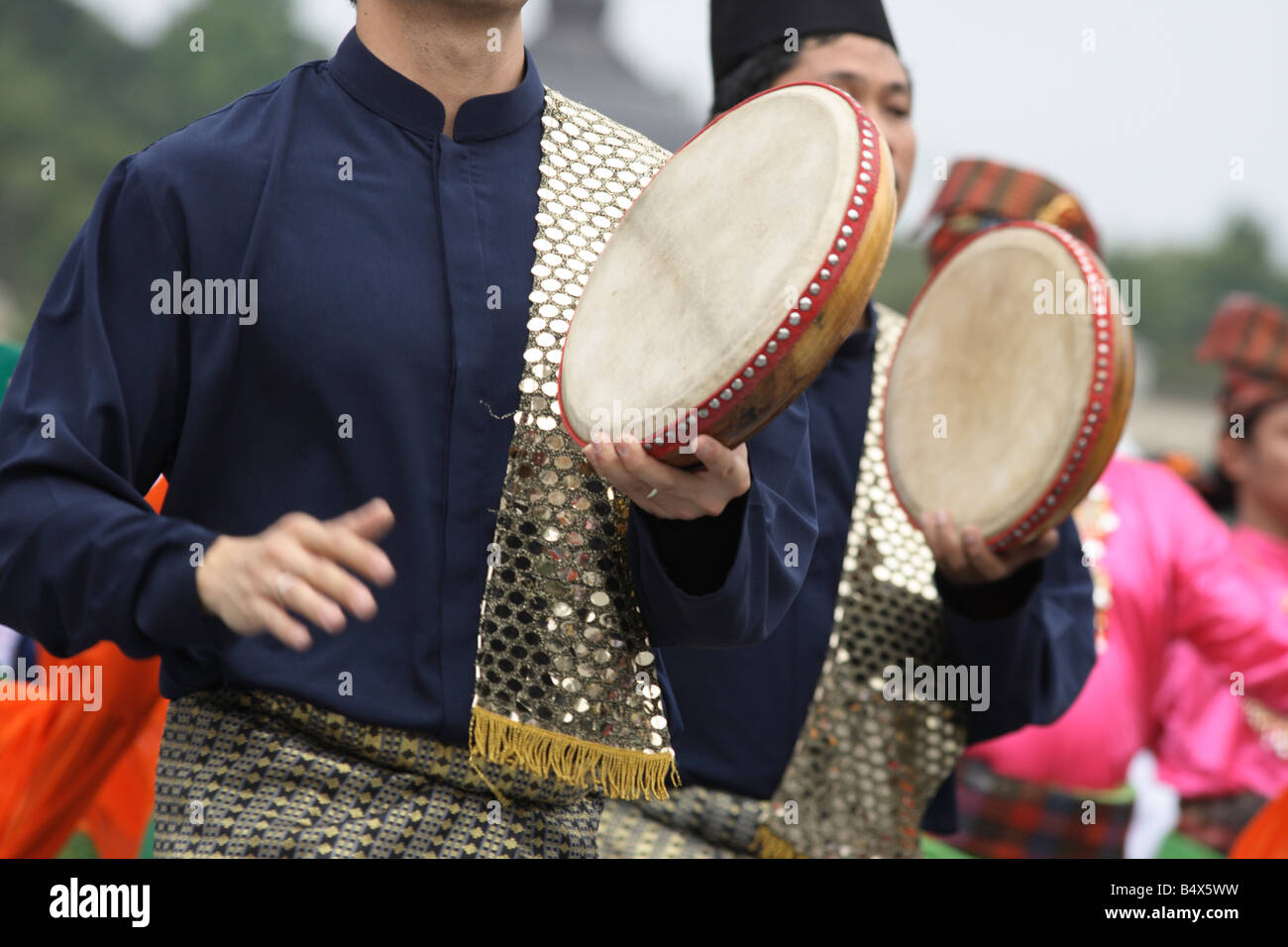 Malay man playing kompang Stock Photo - Alamy