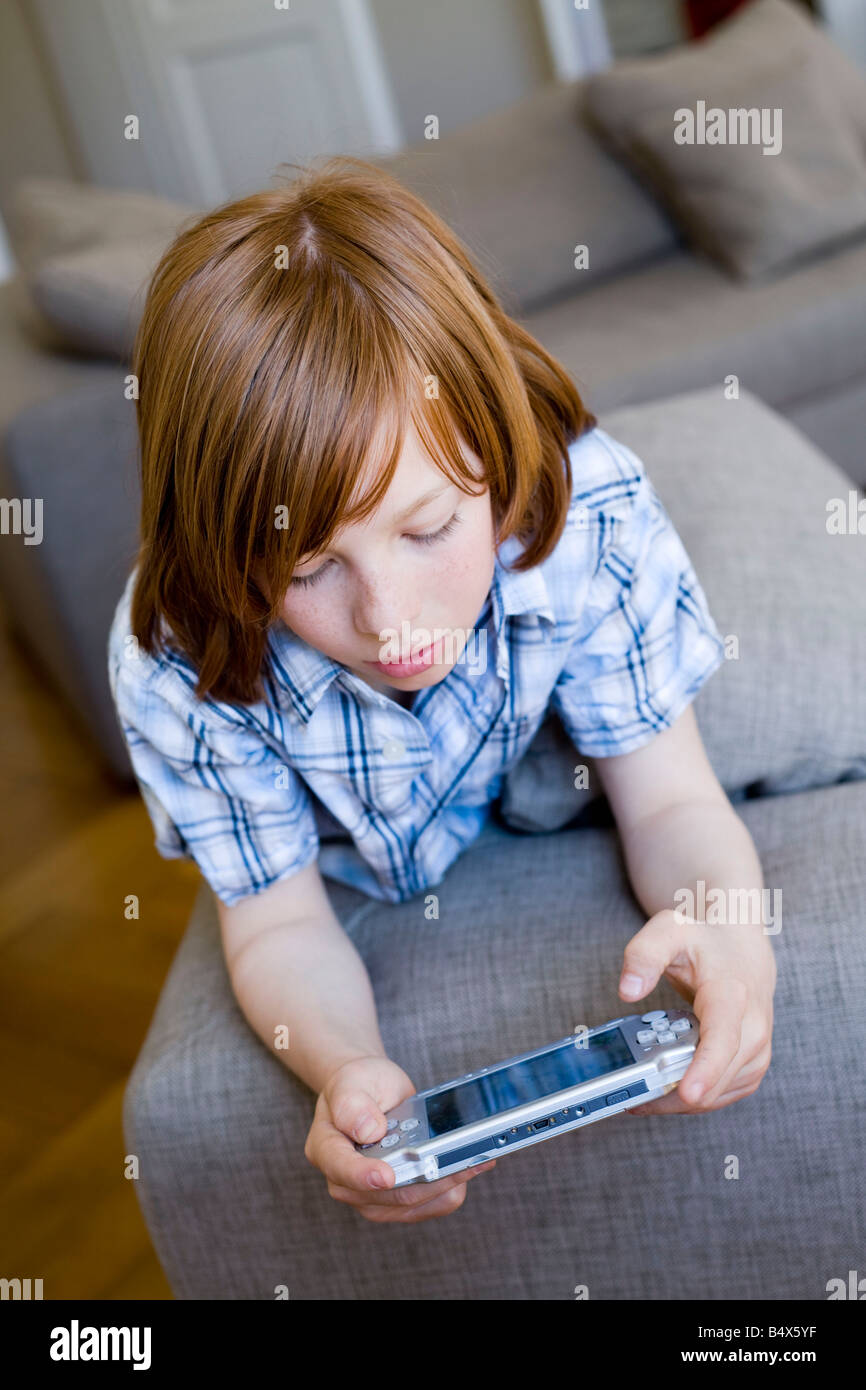 Boy playing video games Stock Photo - Alamy