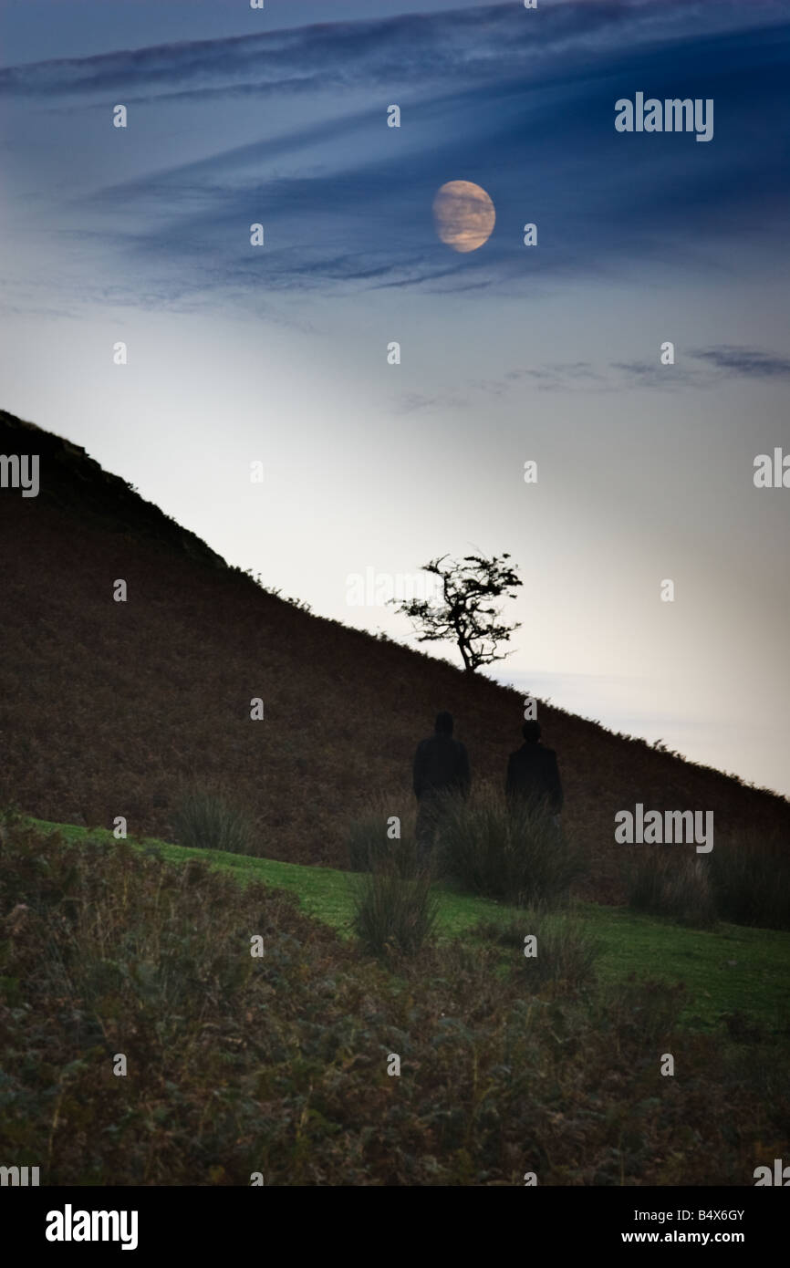 Full moon and two people watching Stock Photo - Alamy