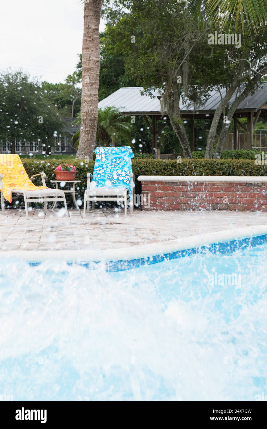 Big splash in swimming pool Stock Photo - Alamy