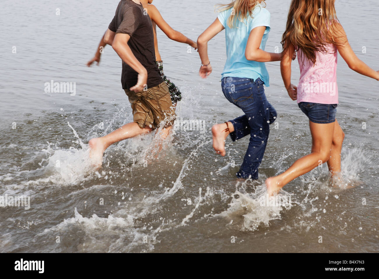 Girl 10 11 running in water hi-res stock photography and images - Alamy