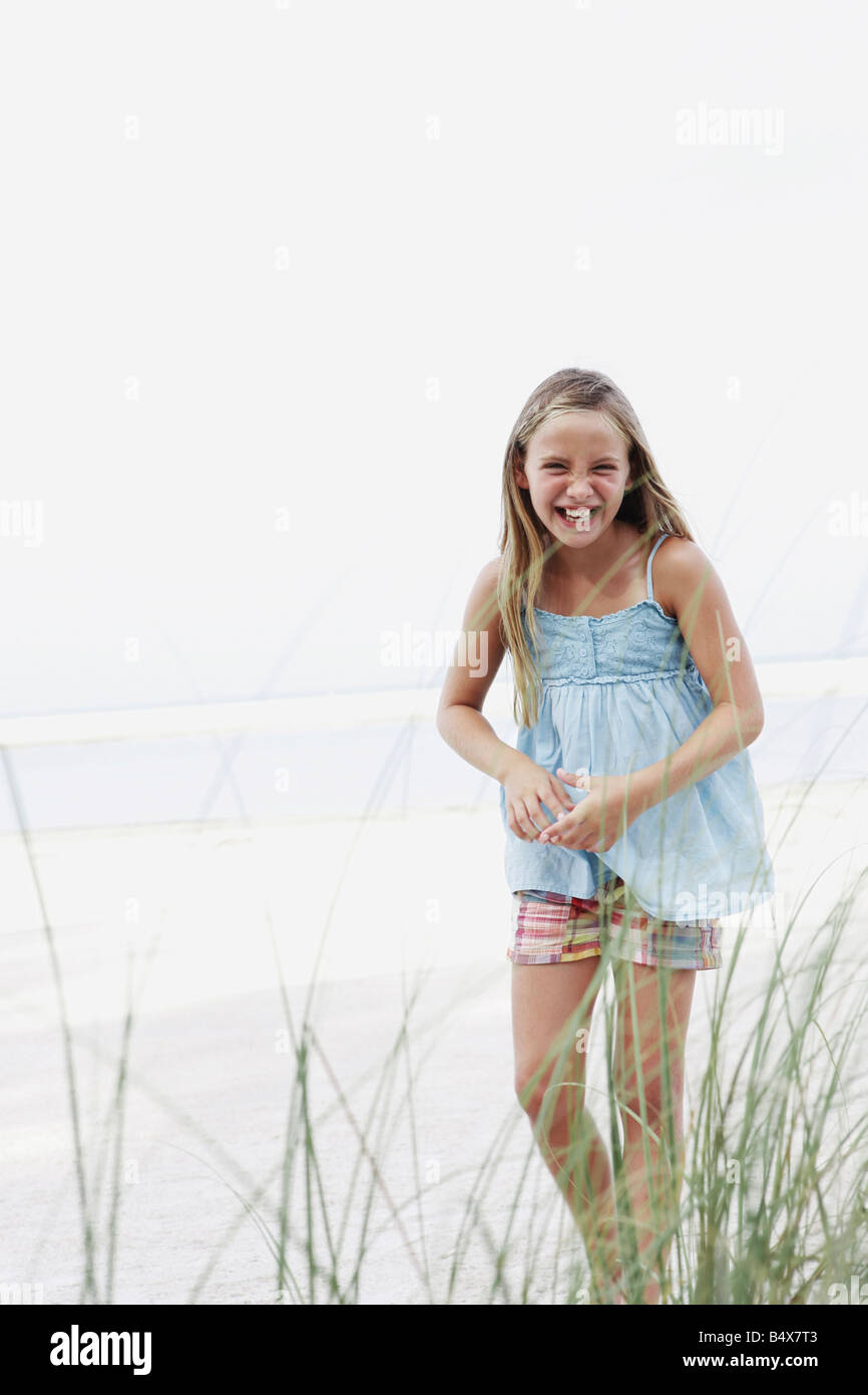 Girl smiling on beach Stock Photo - Alamy