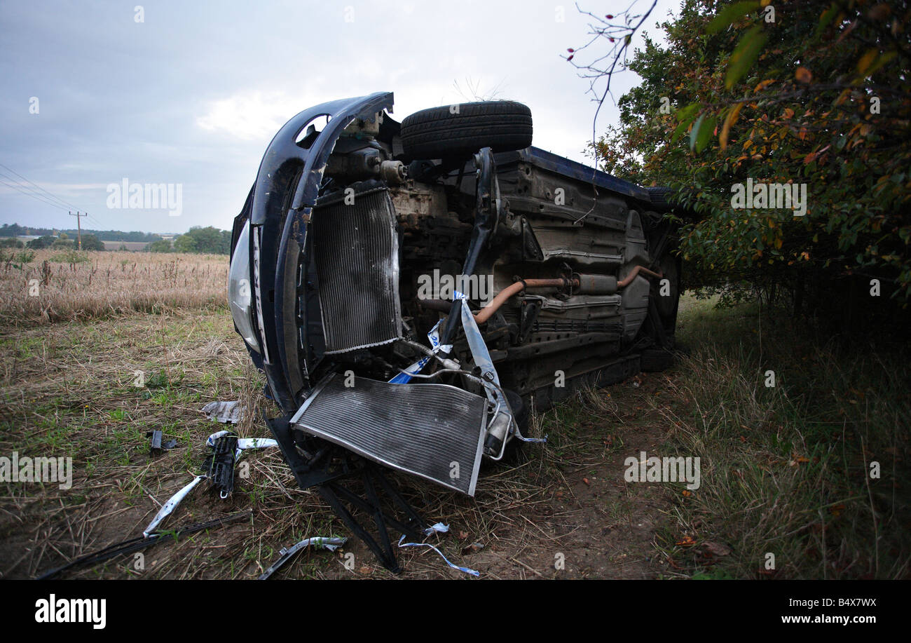 Car on its side after hard crash and roll Stock Photo - Alamy