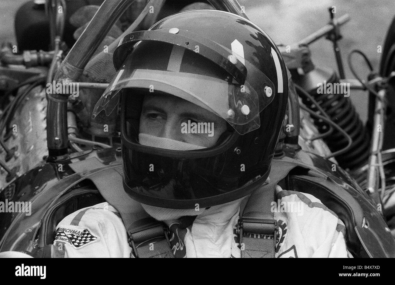 Racing driver Graham Hill at Brands hatch circuit 1970 sitting in Lotus ...