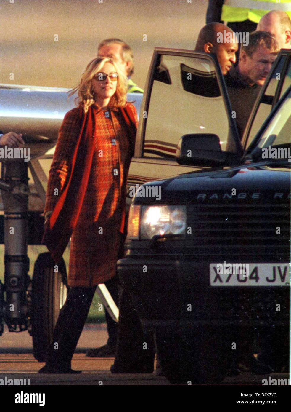 Madonna wearing orange tartan soat scarf sunglasses December 2000 ...