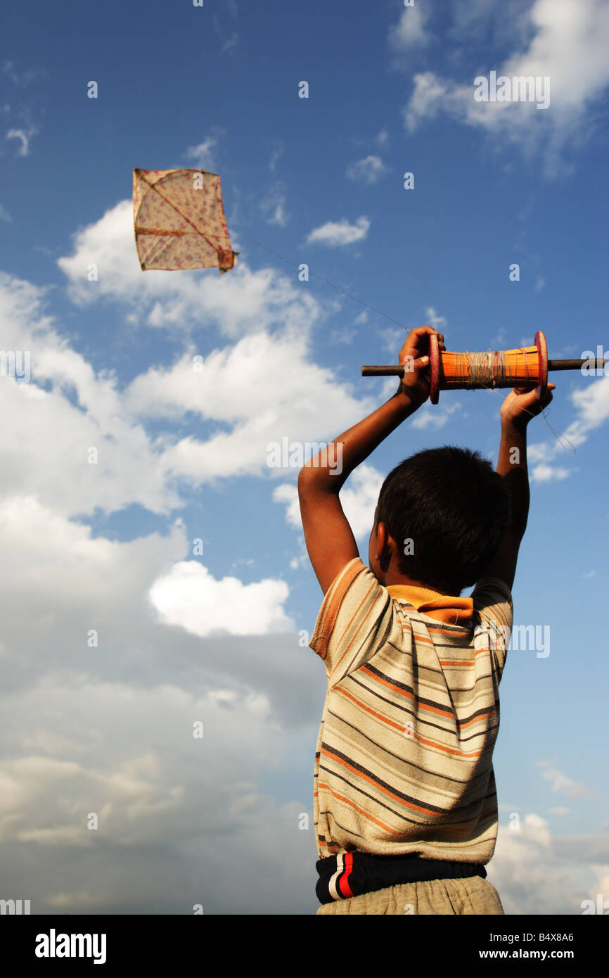 Young boy flying his kite Stock Photo - Alamy
