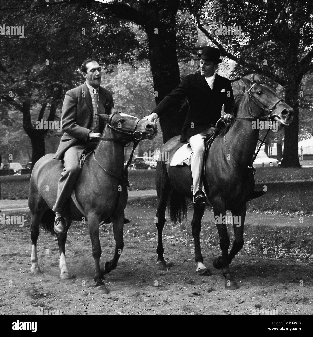 Actors Bernard Bresslaw and Terry Thomas horse riding 1958 Stock Photo ...