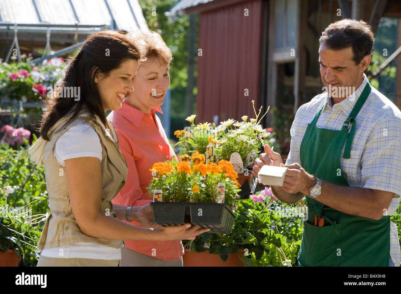 Women paying for flowers Stock Photo - Alamy