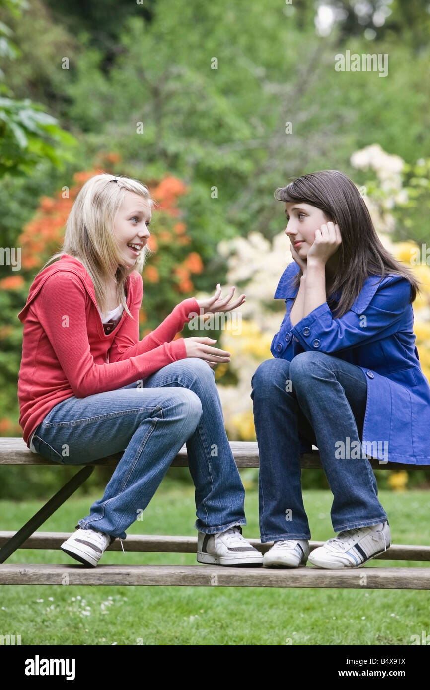 Park bench talking girls hi-res stock photography and images - Alamy