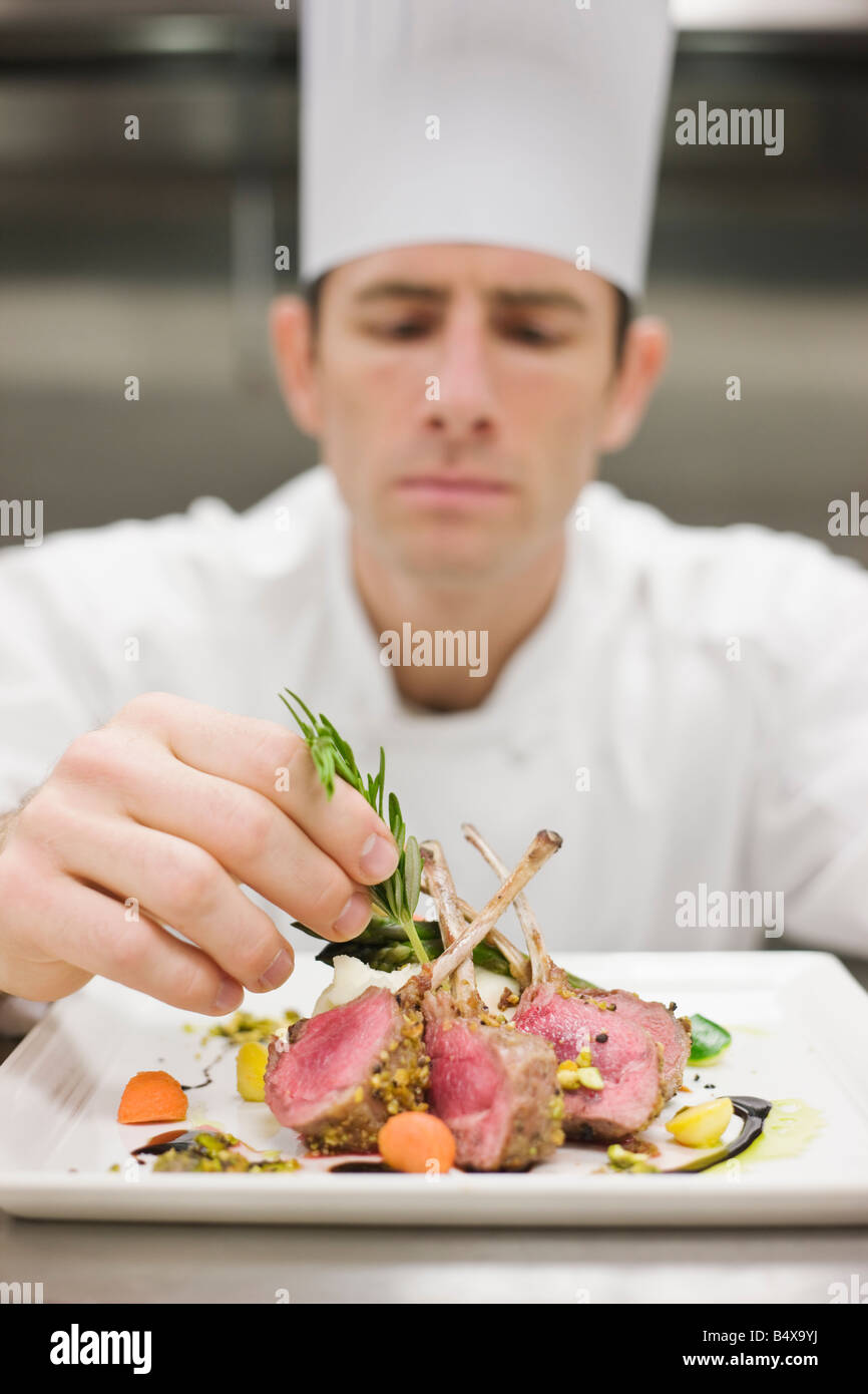 Chef arranging plate of food Stock Photo - Alamy