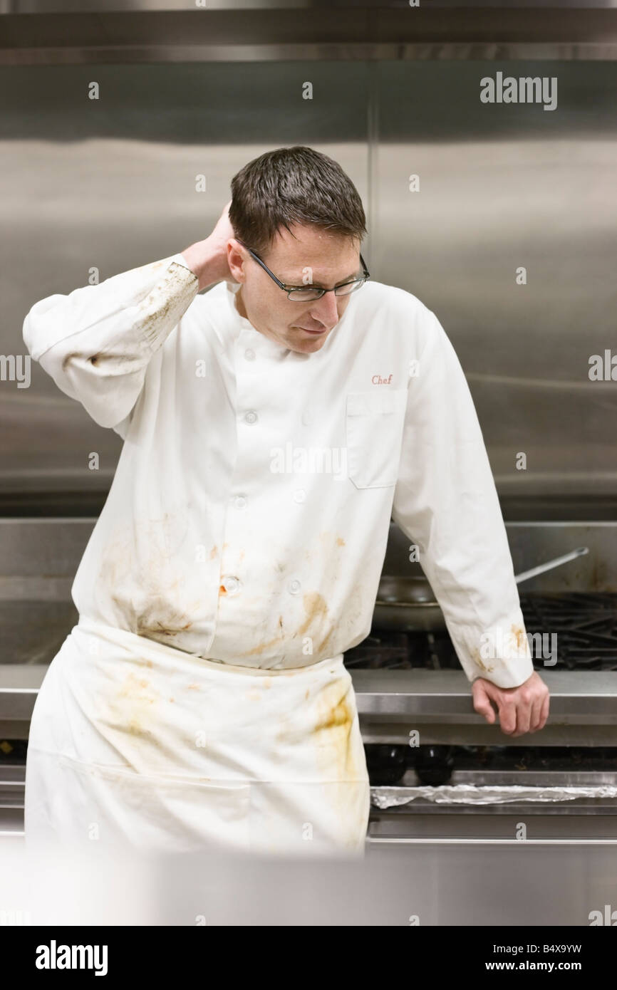 Dirty chef leaning against stove hi-res stock photography and images ...