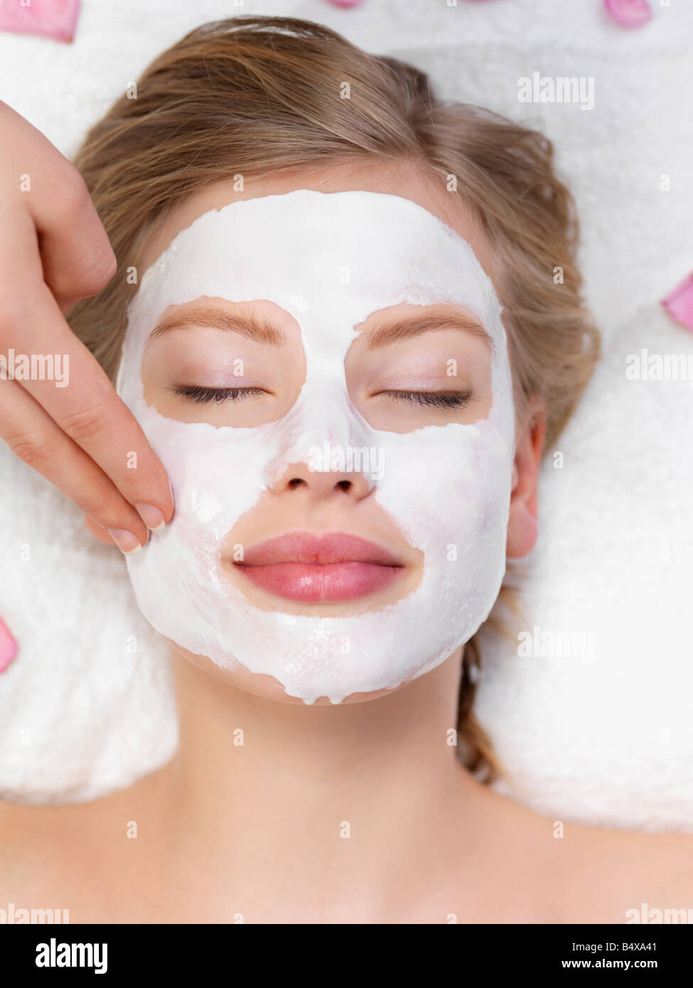 Woman and facial treatment hi-res stock photography and images - Alamy
