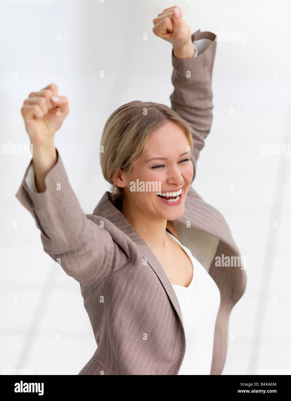 Happy businesswoman celebrating Stock Photo - Alamy