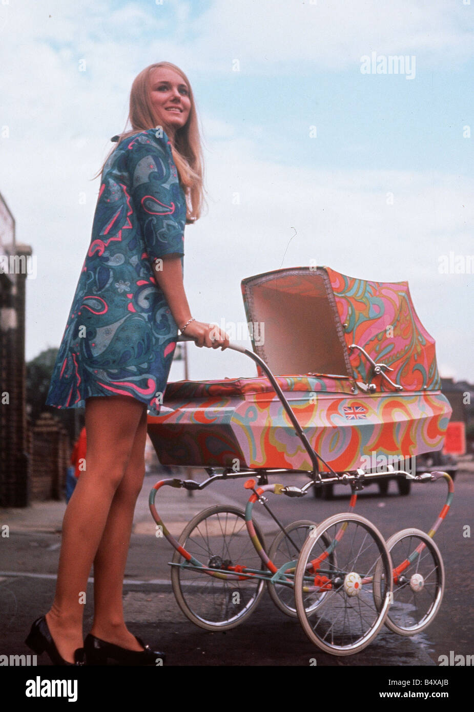 Nicky Hunt in mini dress with psychedelic pram 1967 Stock Photo - Alamy