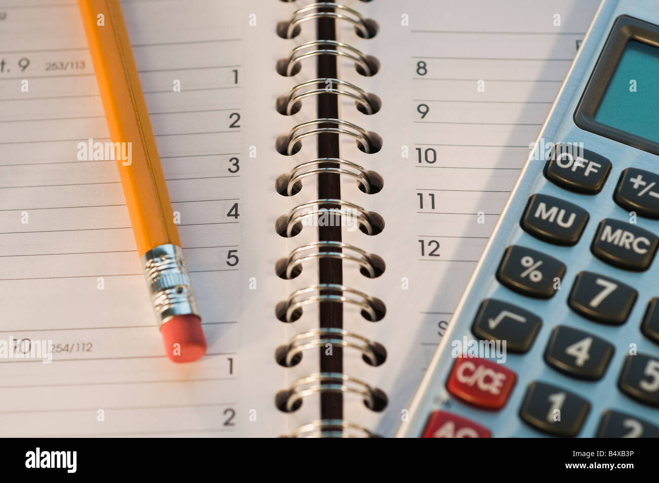 Close up of pencil, notebook and calculator Stock Photo - Alamy
