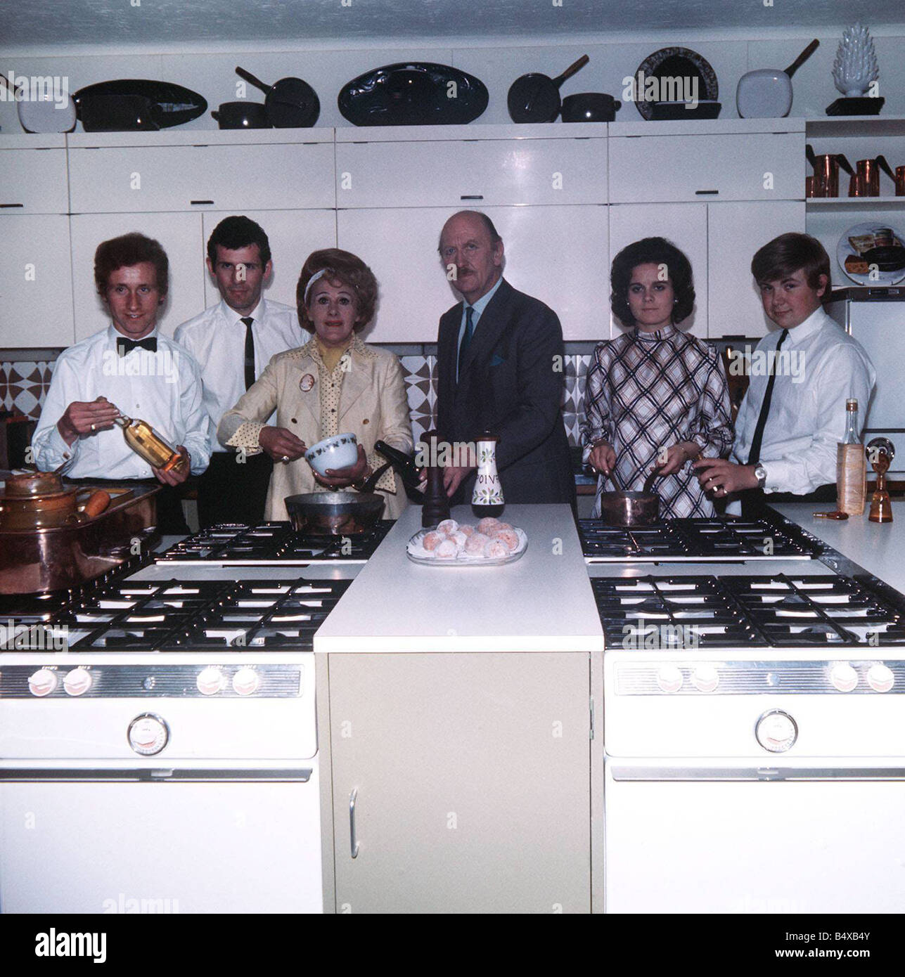 John and Fanny Craddock with TV kitchen assistants in their new home ...