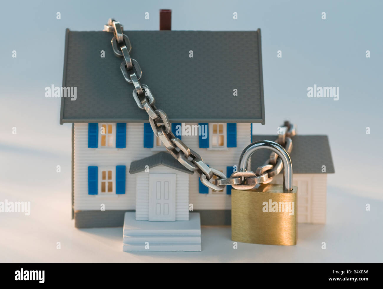 Model house locked with chain Stock Photo - Alamy