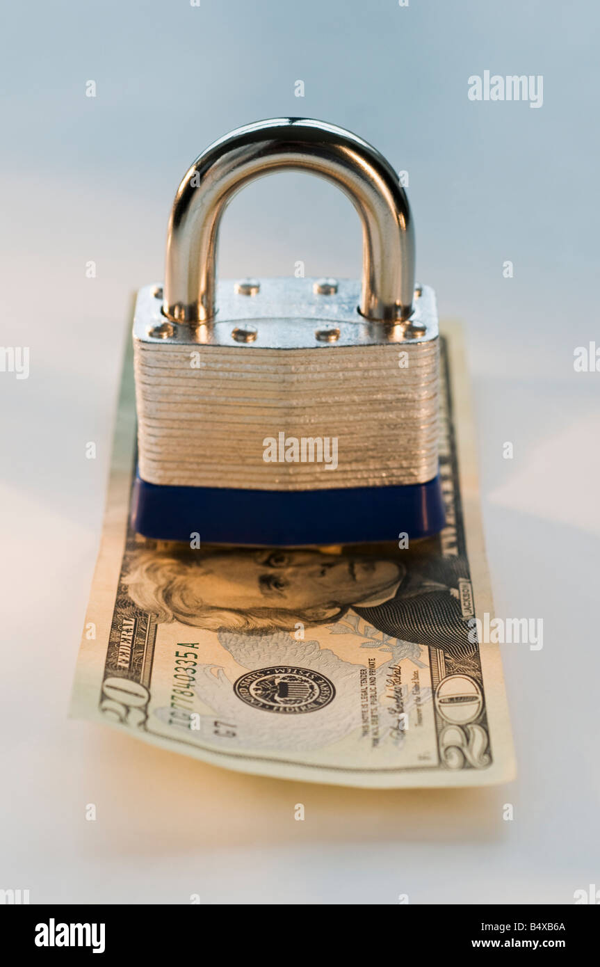 Close up lock and twenty dollar bill Stock Photo - Alamy