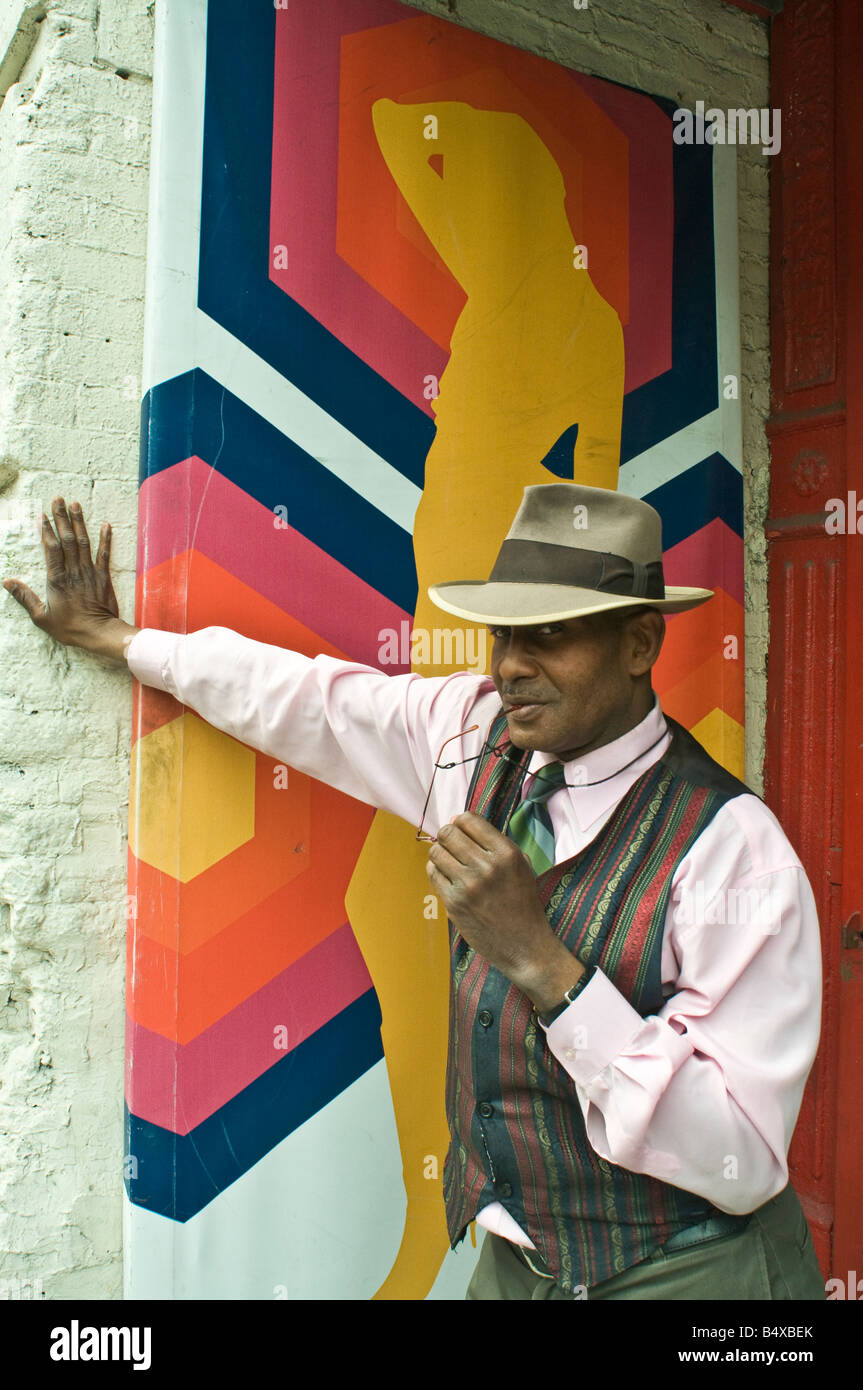 african american salesman outside furniture store NYC Stock Photo - Alamy