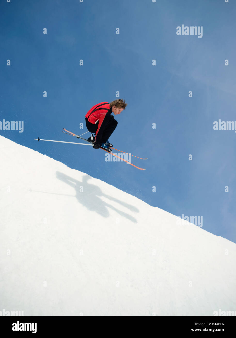 Skier jumping off lip of half-pipe Stock Photo - Alamy