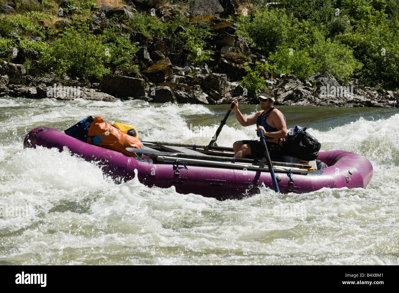 Man whitewater rafting Stock Photo - Alamy