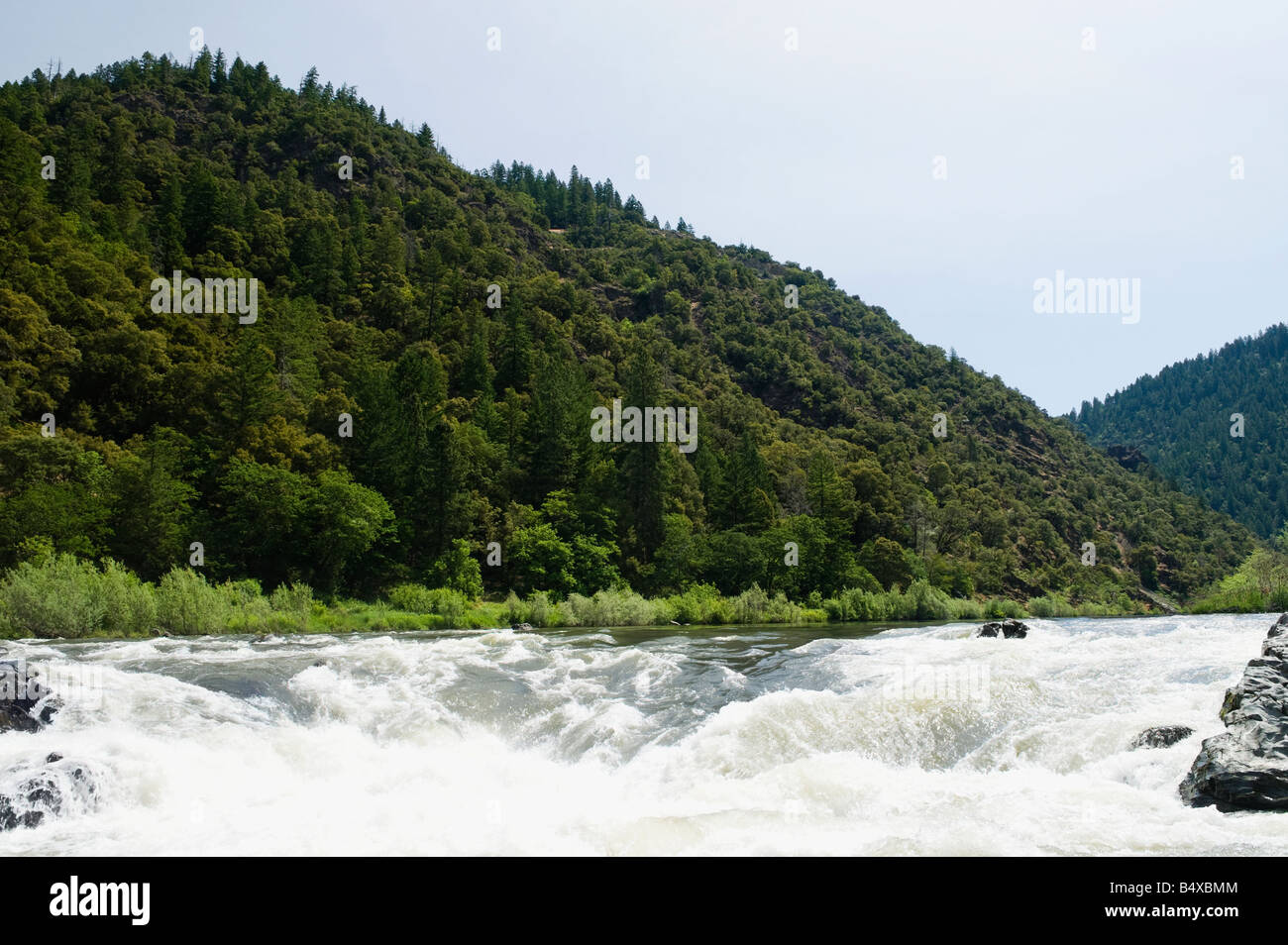 Whitewater raft approaching waterfall Stock Photo - Alamy