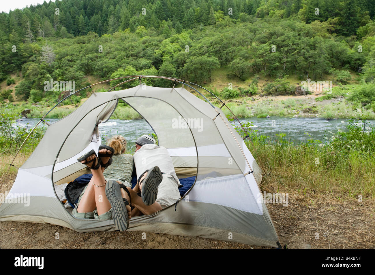 Couple camping laying in tent hi-res stock photography and images - Alamy