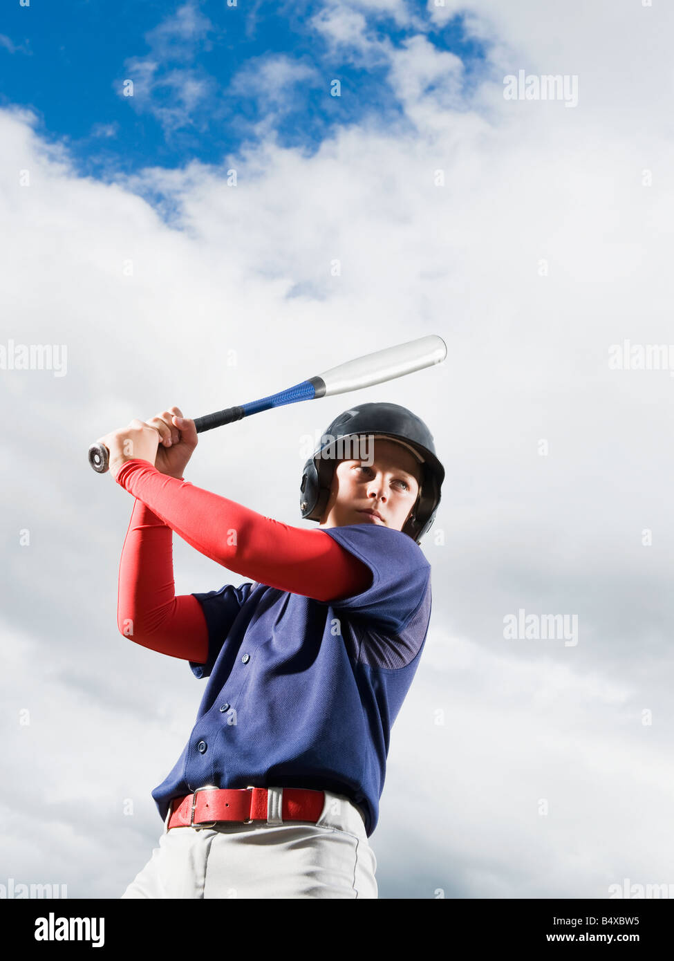 Baseball player reading to swing bat Stock Photo - Alamy