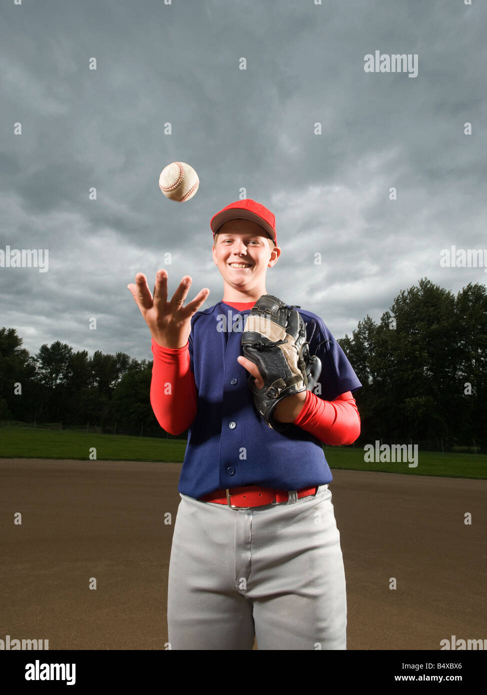 Child tossing ball air hi-res stock photography and images - Alamy