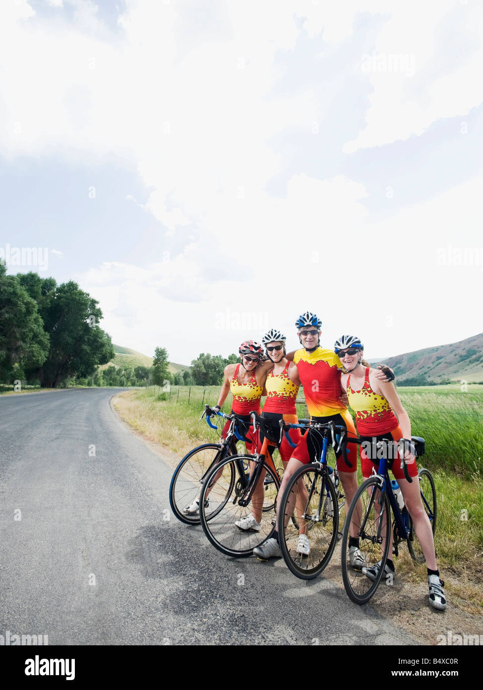 Four cyclists riding together hi-res stock photography and images - Alamy
