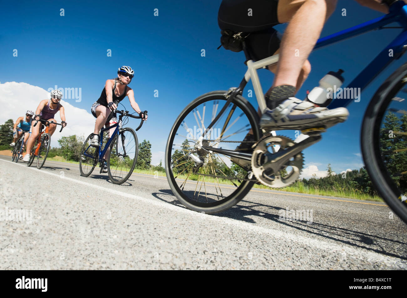Four cyclists riding together hi-res stock photography and images - Alamy