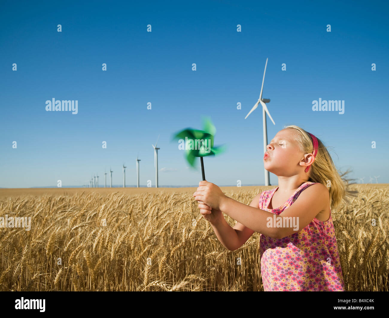 Girl with a pinwheel hi-res stock photography and images - Alamy