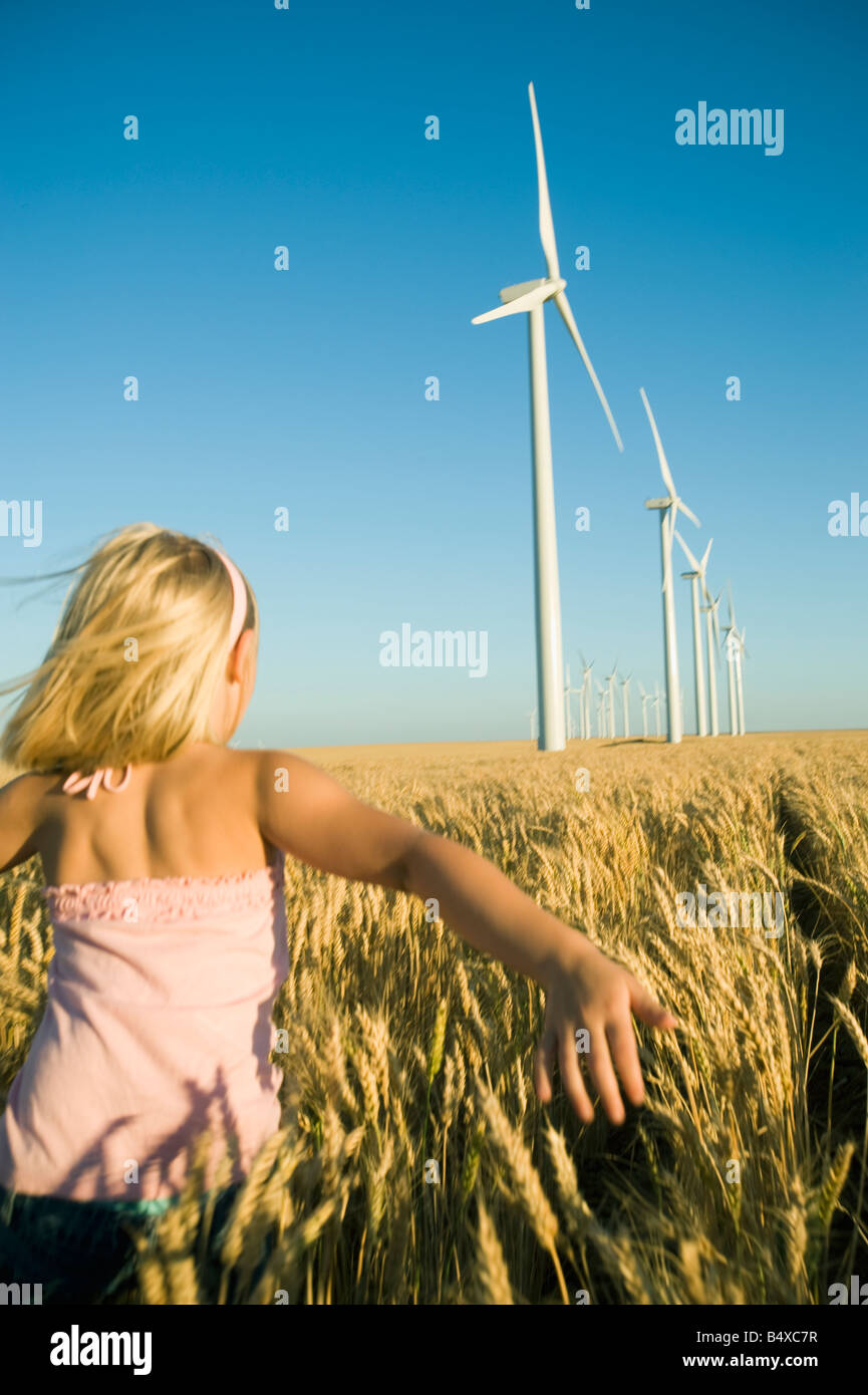 Girl running through wheat field hi-res stock photography and images ...