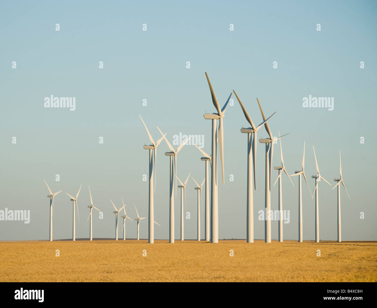 Rows of windmills on wind farm Stock Photo - Alamy