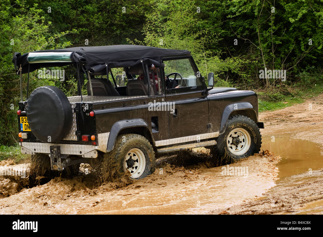 Land Rover defender driving off road Stock Photo - Alamy
