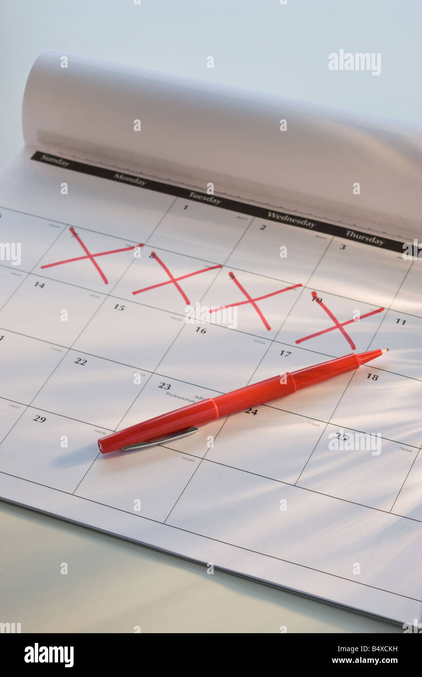 Close up calendar with days marked off Stock Photo - Alamy