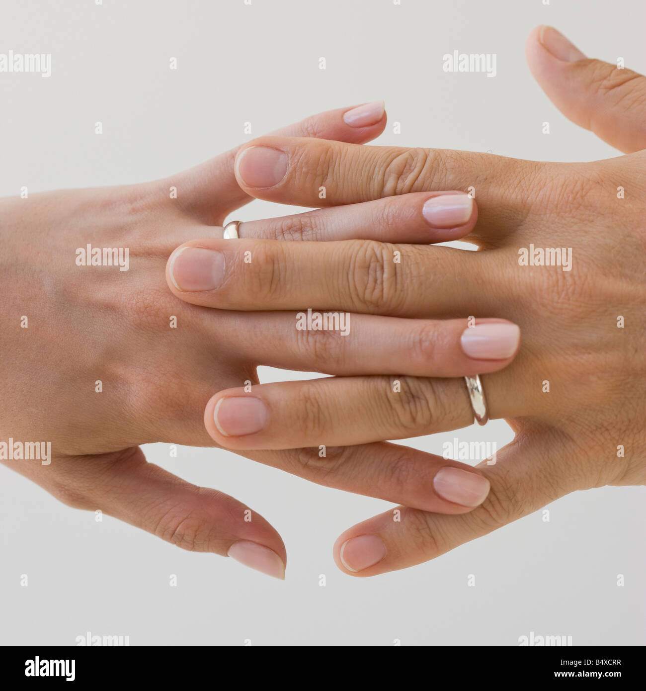 Wedding rings on couple’s hands Stock Photo - Alamy