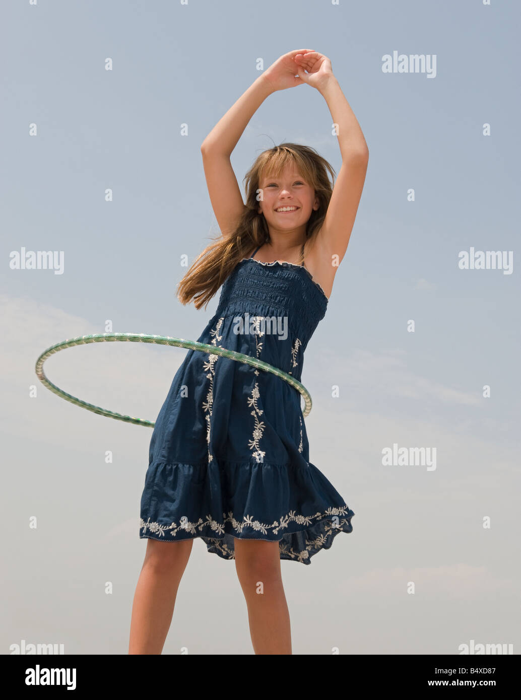 Girl hula hooping Stock Photo - Alamy
