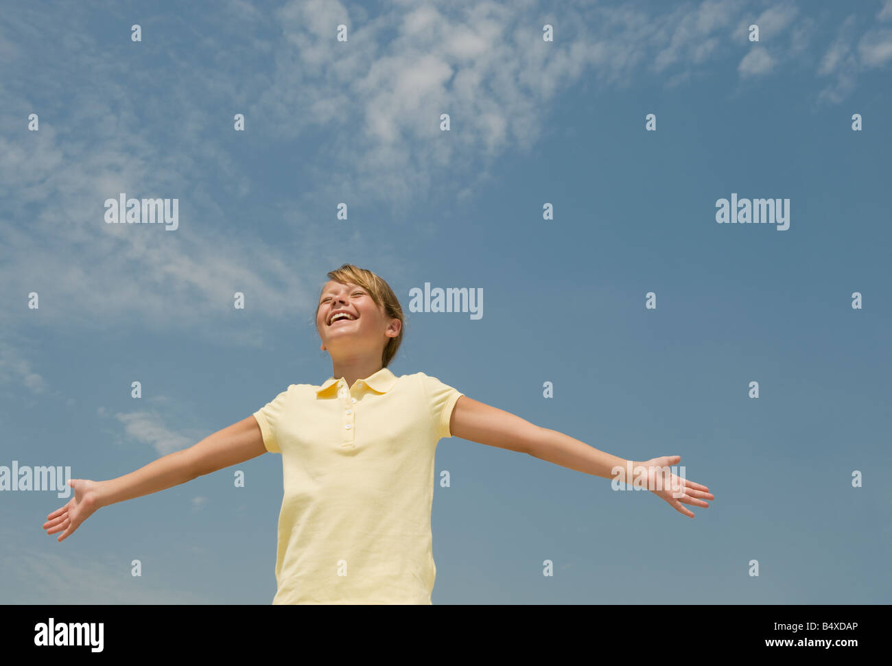 Girl with arms outstretched Stock Photo - Alamy