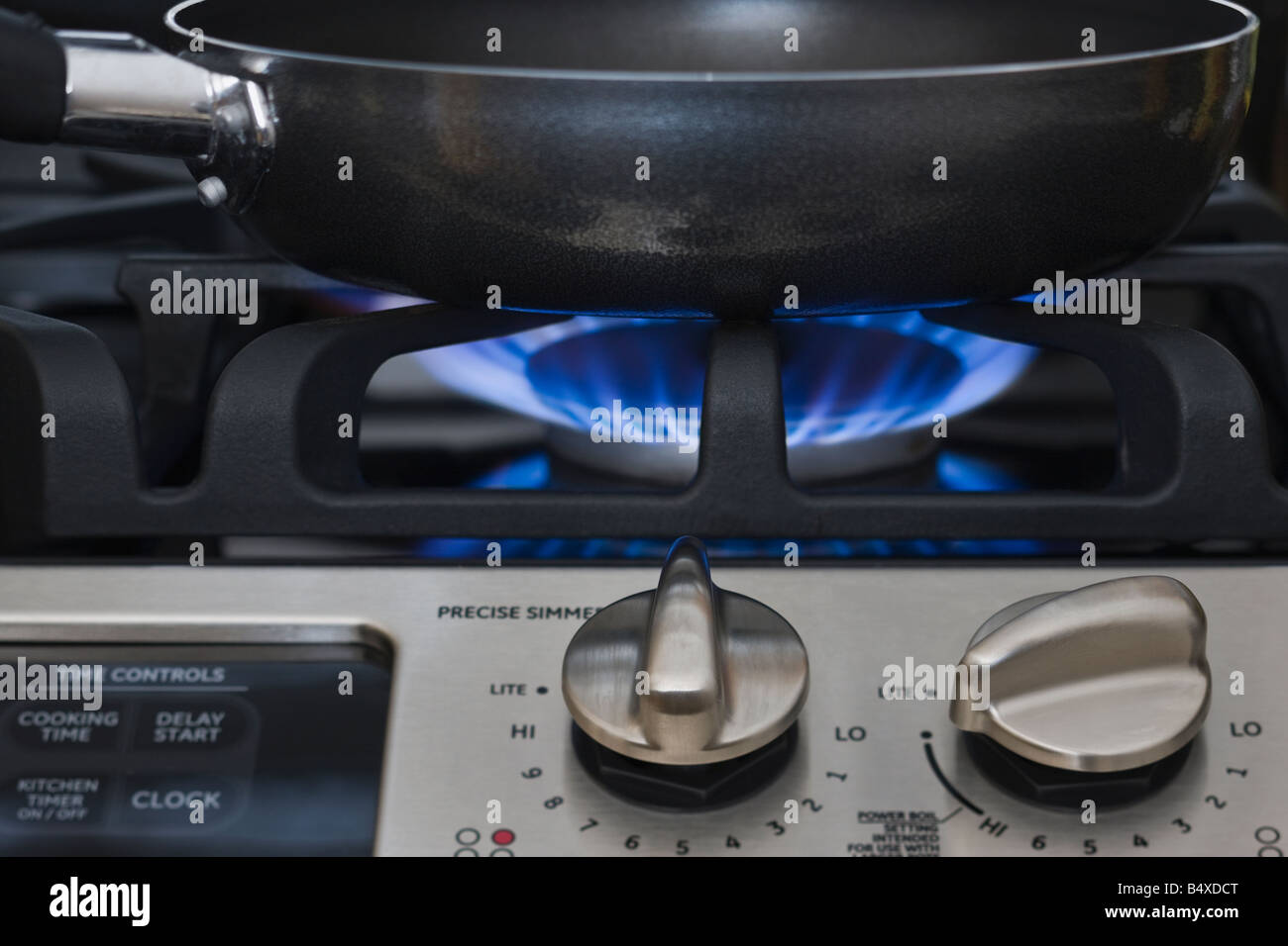 Close up of skillet on gas stove Stock Photo - Alamy