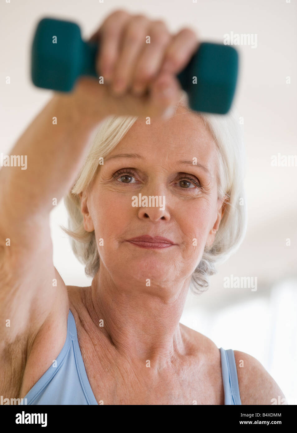 Senior woman lifting hand weight Stock Photo - Alamy