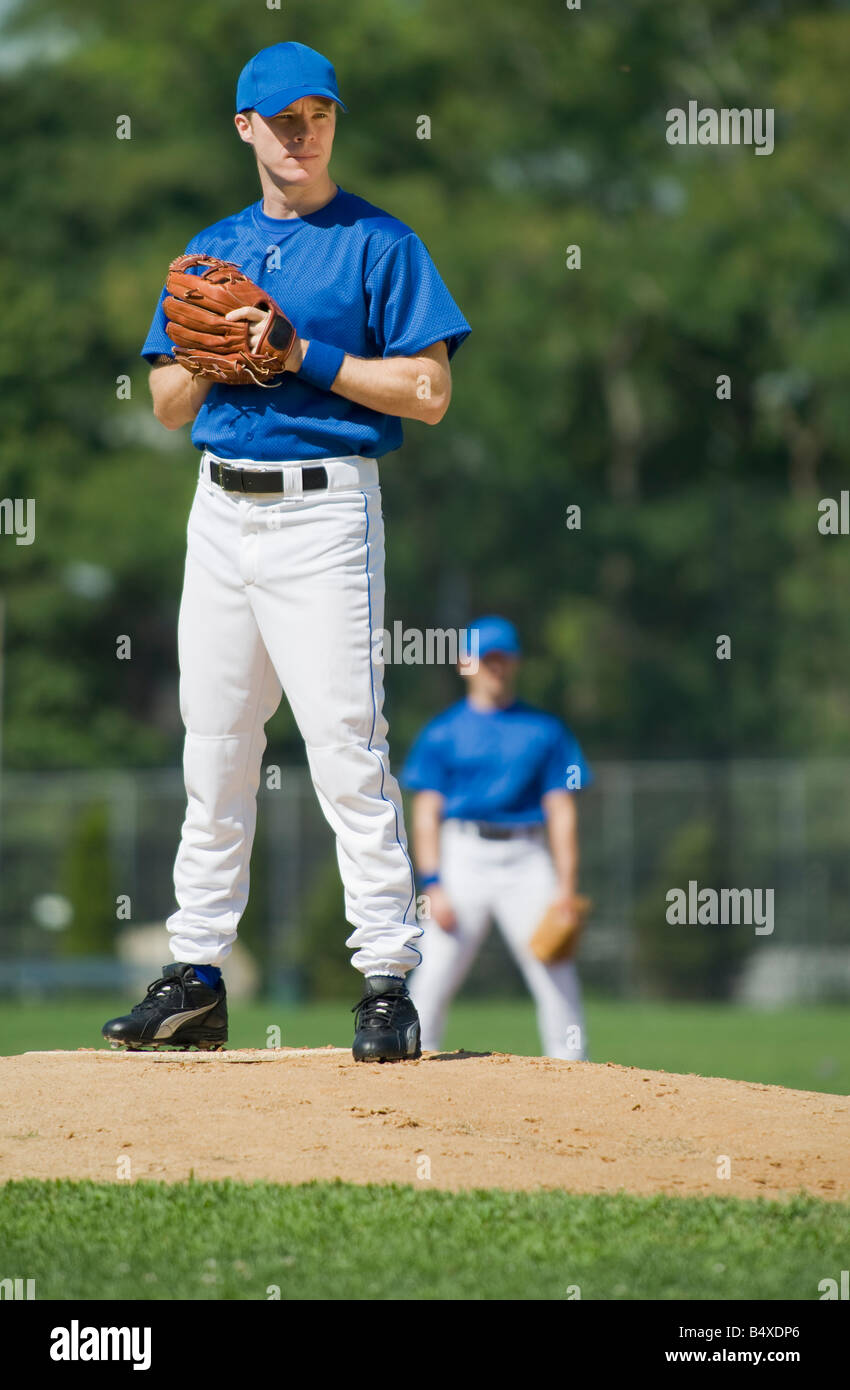 Baseball pitcher preparing to pitch ball Stock Photo - Alamy