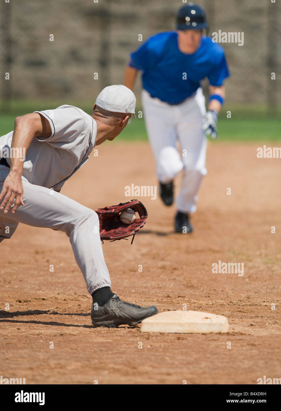 Baseball player trying to steal base Stock Photo - Alamy