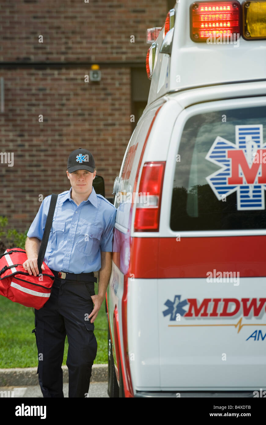EMT posing in front of ambulance Stock Photo - Alamy