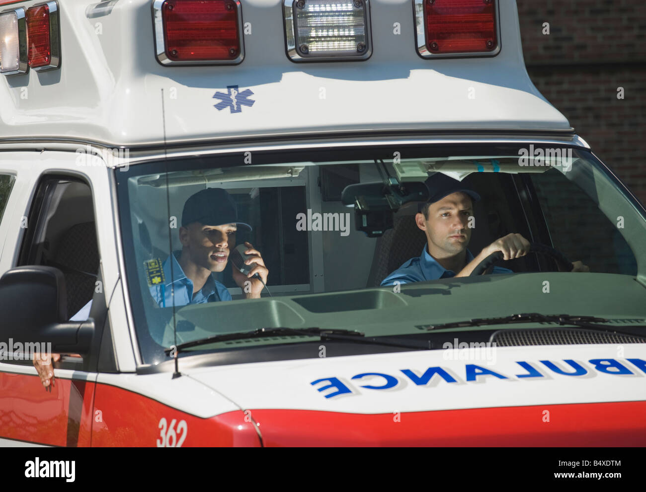 EMT’s driving in ambulance Stock Photo - Alamy