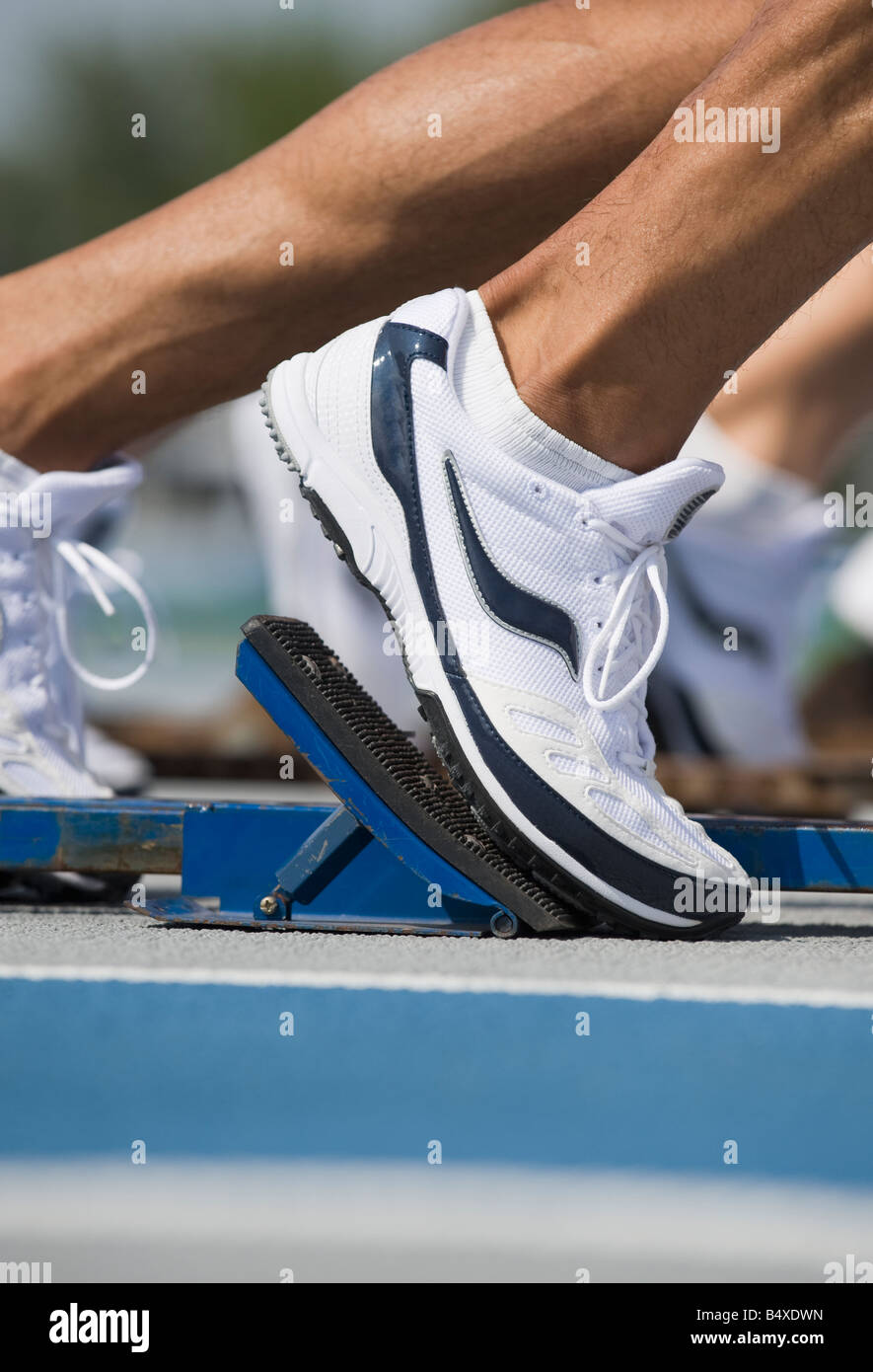 Runners on starter block Stock Photo - Alamy